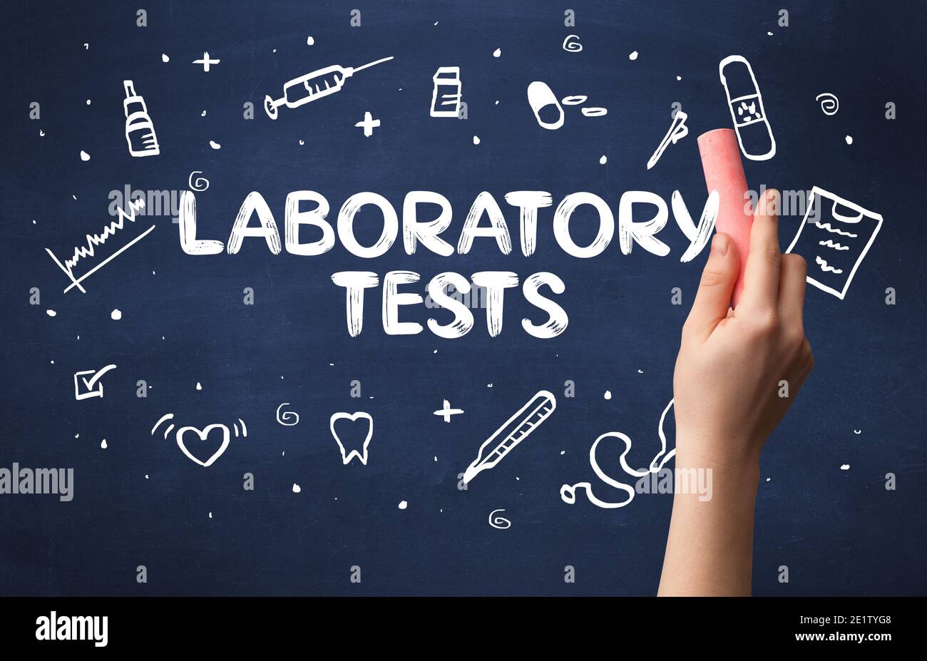 Hand drawing LABORATORY TESTS inscription with white chalk on ...