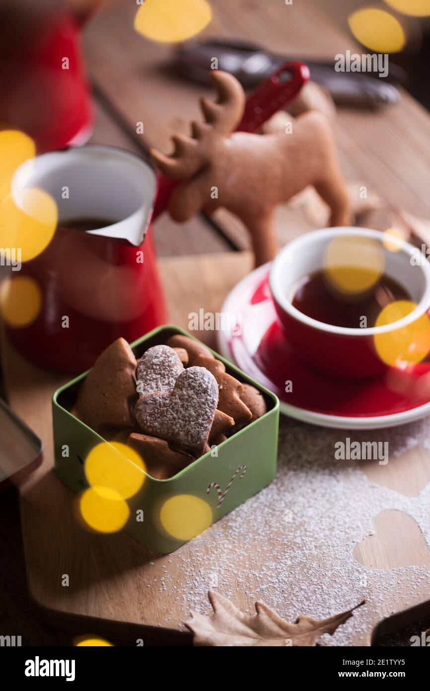 christmas still life. gingerbread in a box on the background of a cup ...