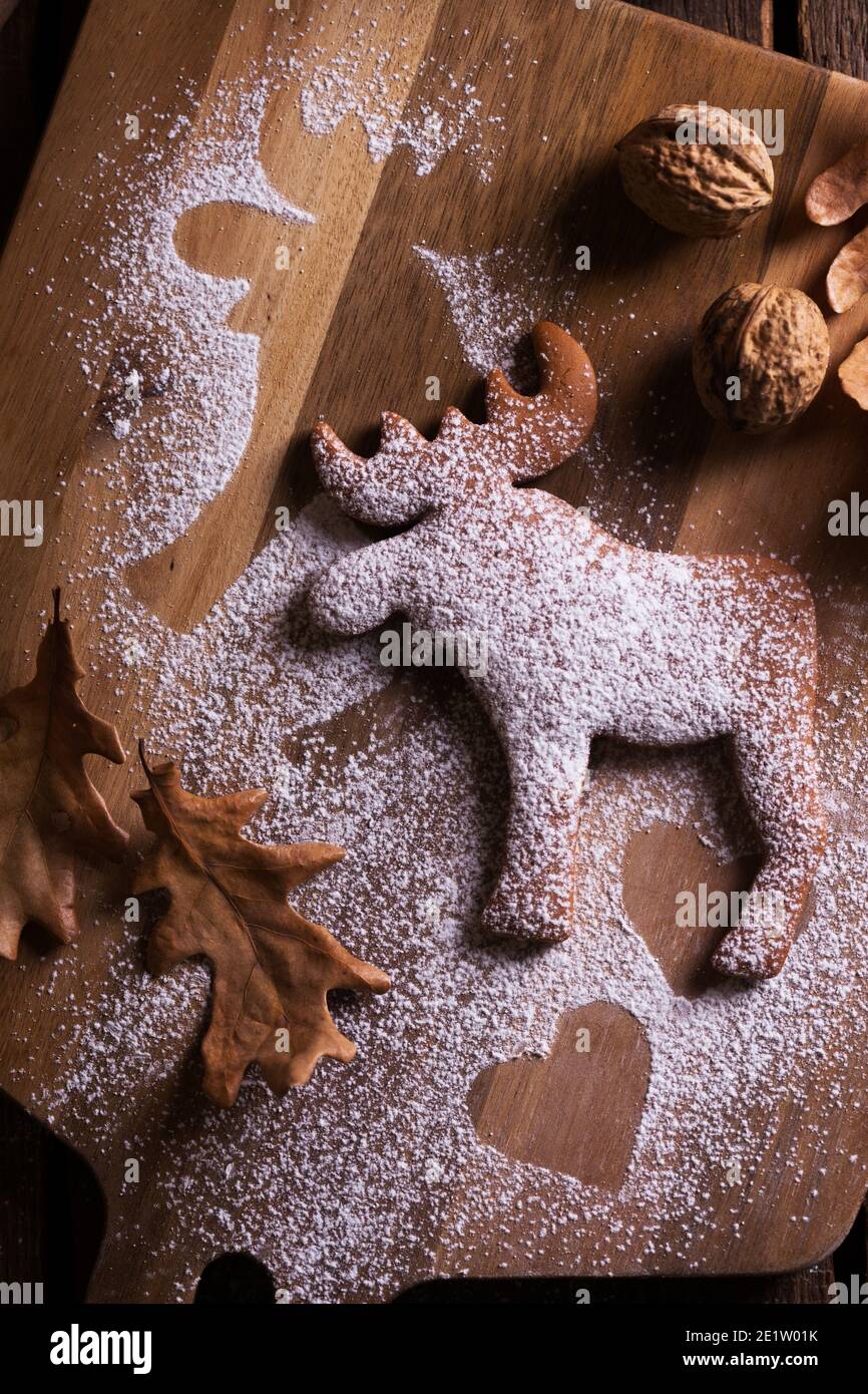 christmas still life. background from gingerbread in the form of an elk ...