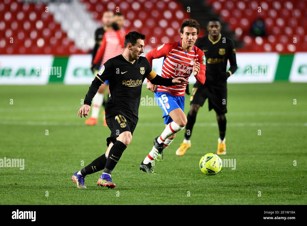 FC Barcelona player Lionel Messi and Granada CF player Luis Milla are ...