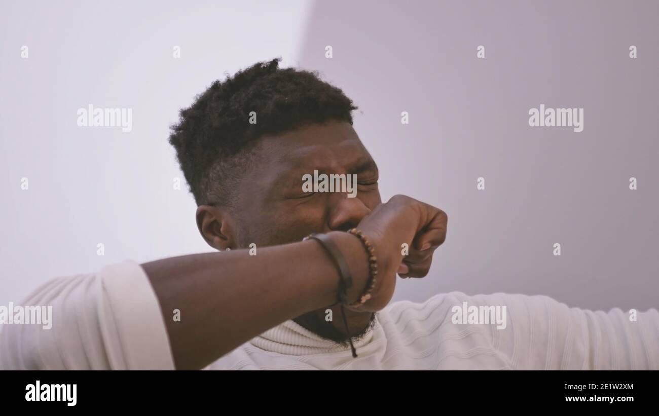 Bored black man yawning. . High quality photo Stock Photo - Alamy