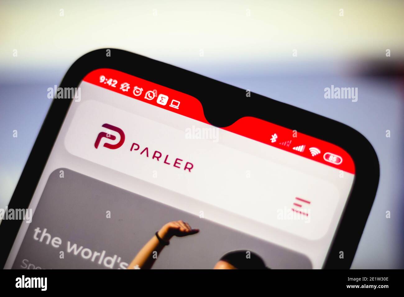 In this photo illustration the Parler logo seen displayed on a ...