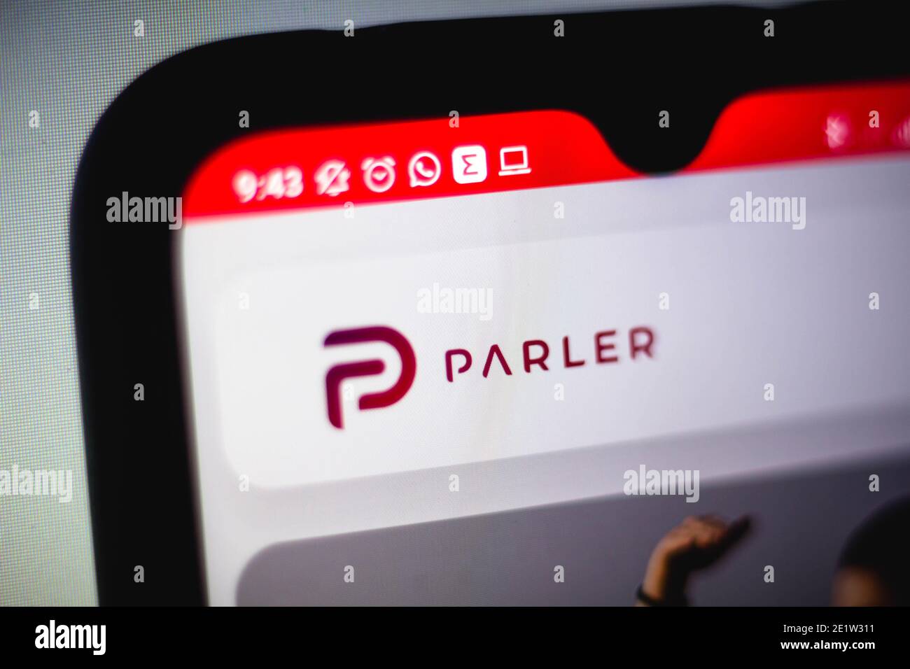 In this photo illustration the Parler logo seen displayed on a ...