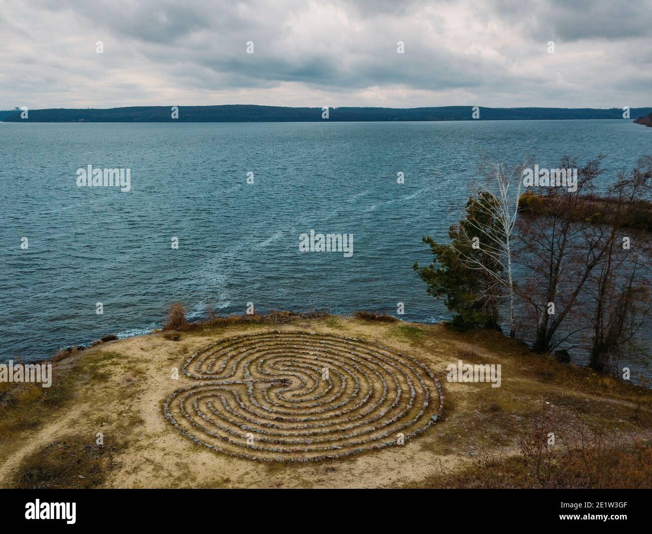 Spiral labyrinth made of stones on the coast, aerial view Stock Photo ...