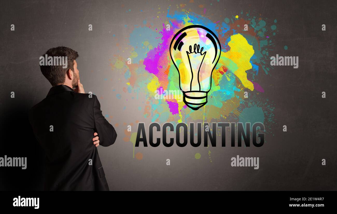 businessman drawing colorful light bulb with ACCOUNTING inscription on ...
