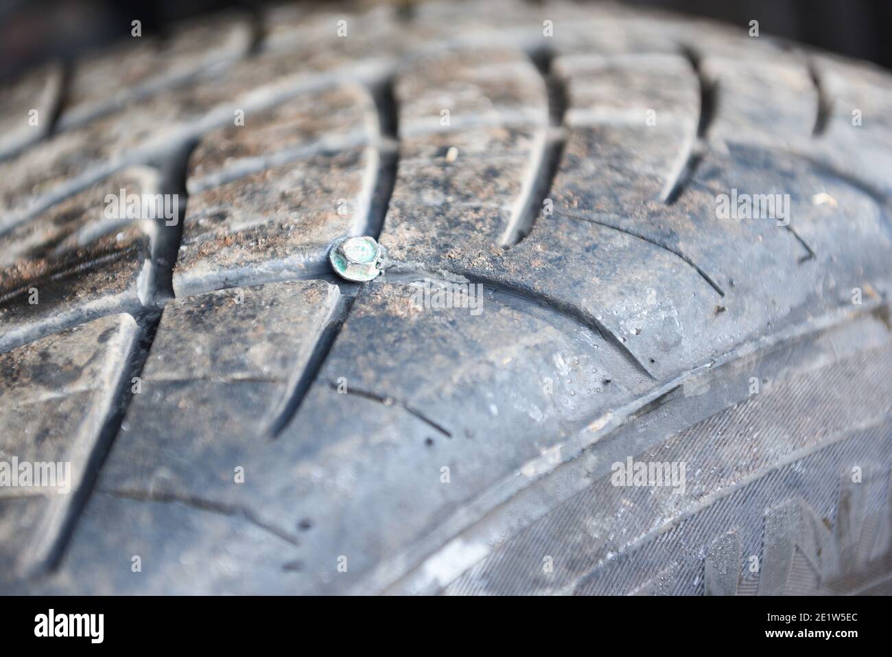 Car tires nail embedded in the broken tire, Screw in the black tire ...