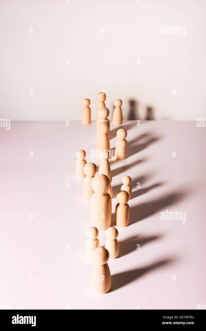 Figures in the shape of people casting shadows on a flat surface Stock ...