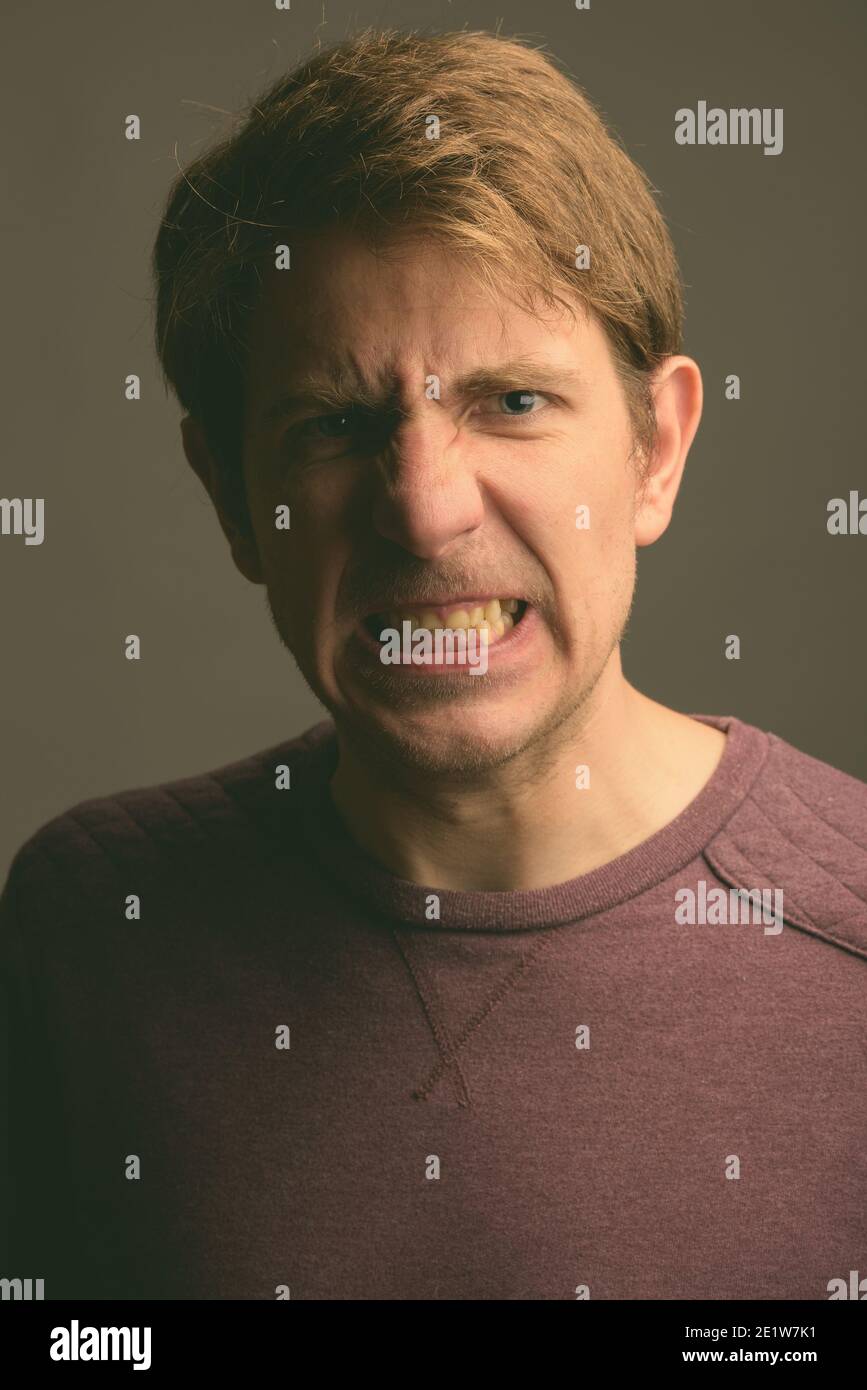 Man gritting teeth hi-res stock photography and images - Alamy