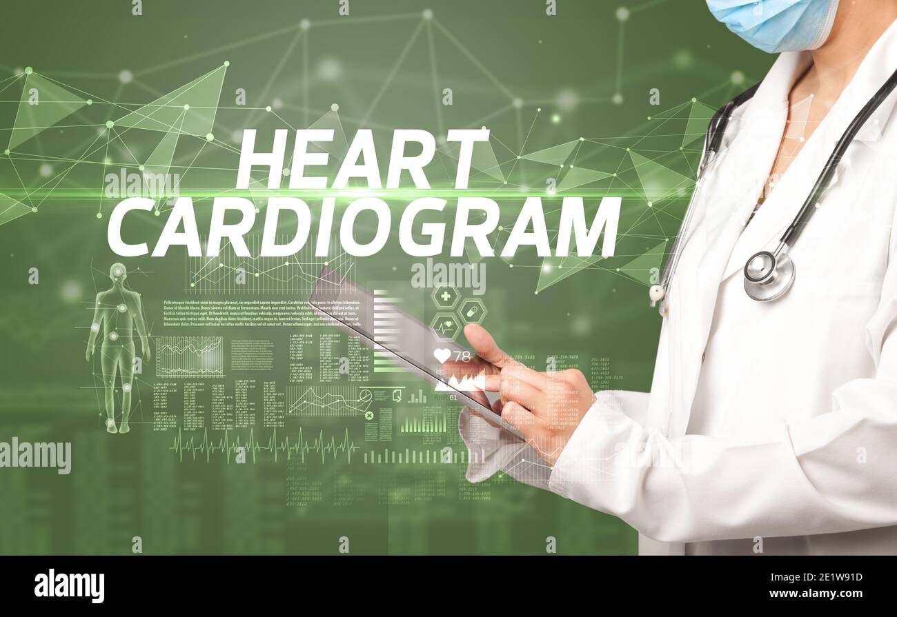 doctor writes notes on the clipboard with HEART CARDIOGRAM inscription ...