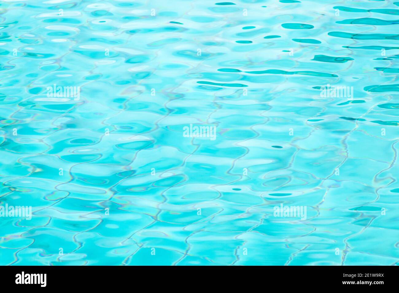 Ripple Water in swimming pool with blue tile floor background Stock ...