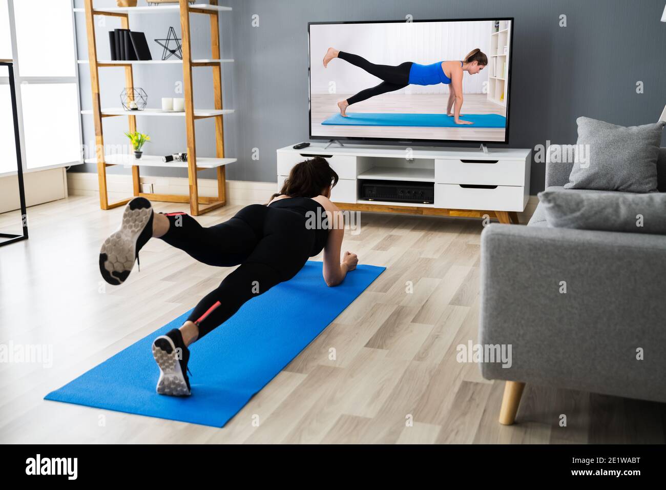 Online TV Home Fitness Workout And Exercise Stock Photo - Alamy