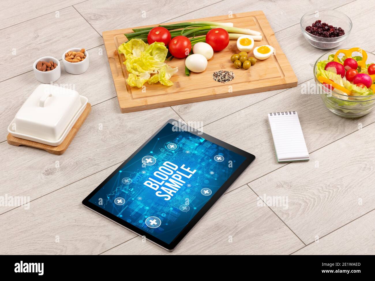 BLOOD SAMPLE concept in tablet pc with healthy food around, top view ...