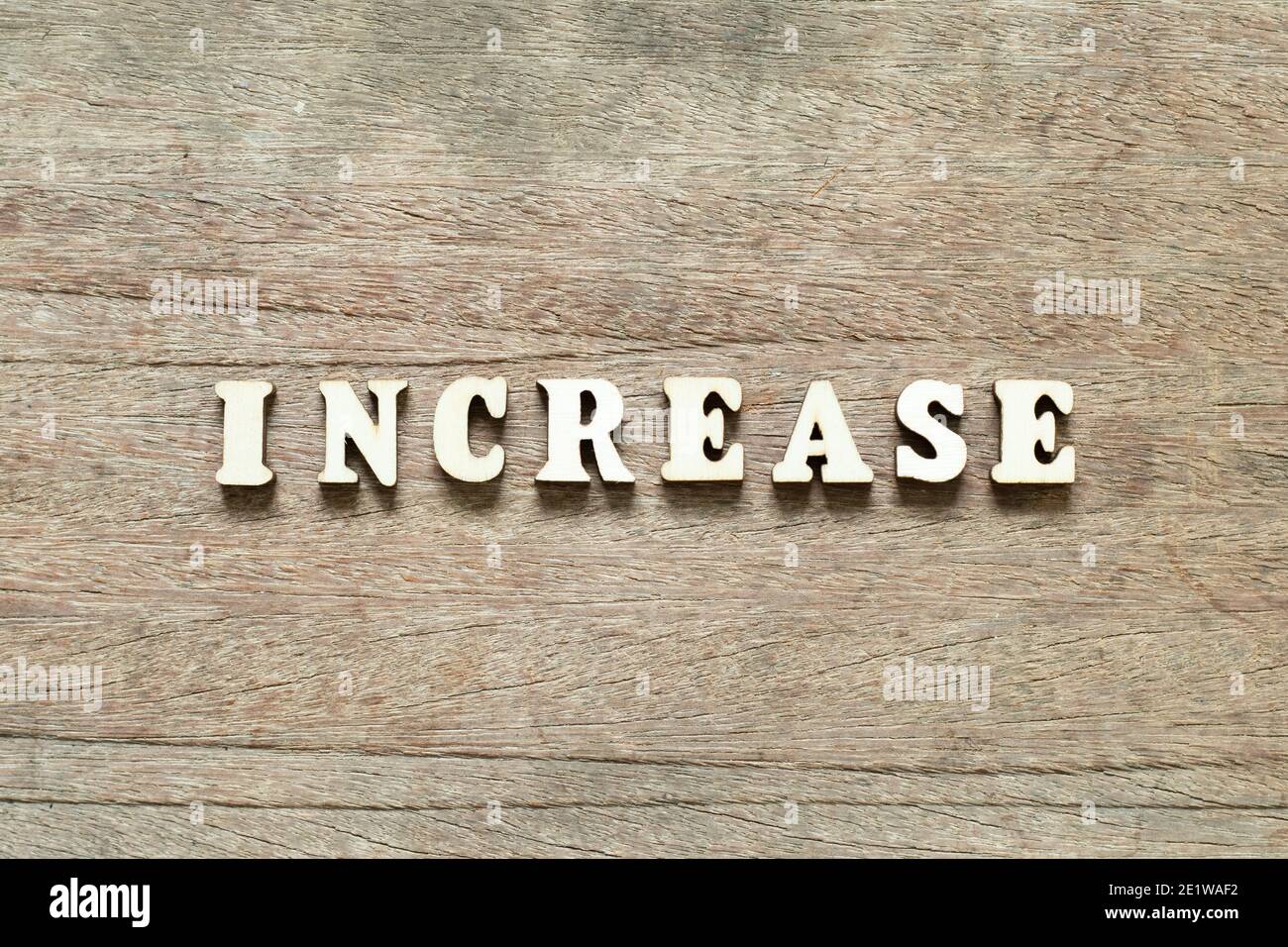 Alphabet letter block in word increase on wood background Stock Photo ...
