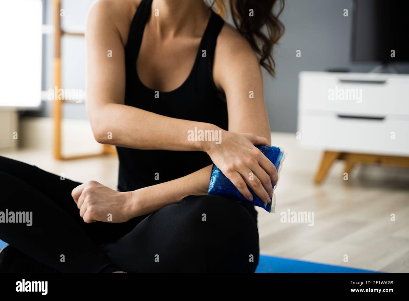Applying Ice Pack Gel Against Elbow Pain Stock Photo - Alamy