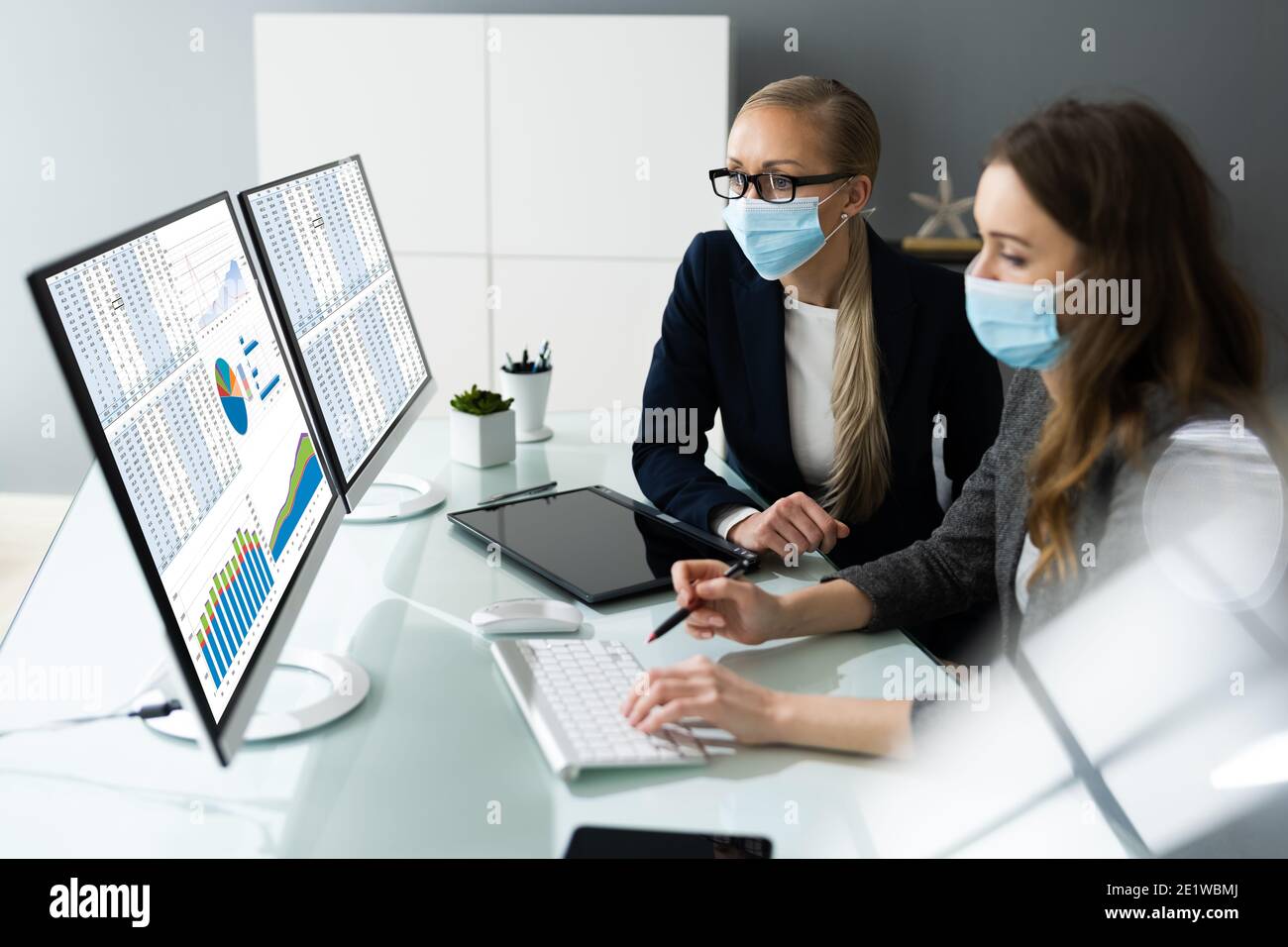 Spreadsheet Data Analysts Using Computer Wearing Face Masks Stock Photo ...