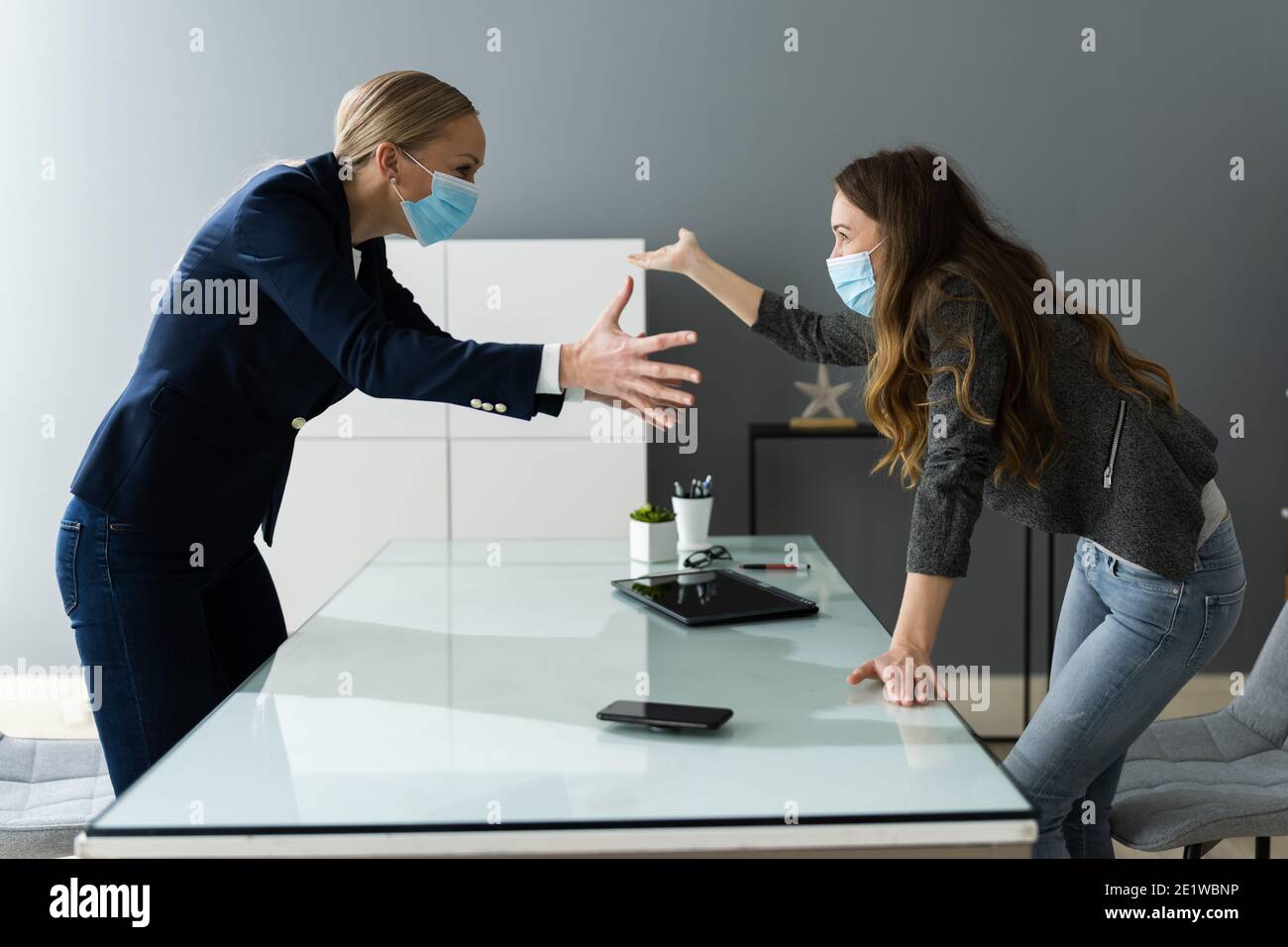 Angry Women Fighting And Shouting At Work With Face Masks Stock Photo ...