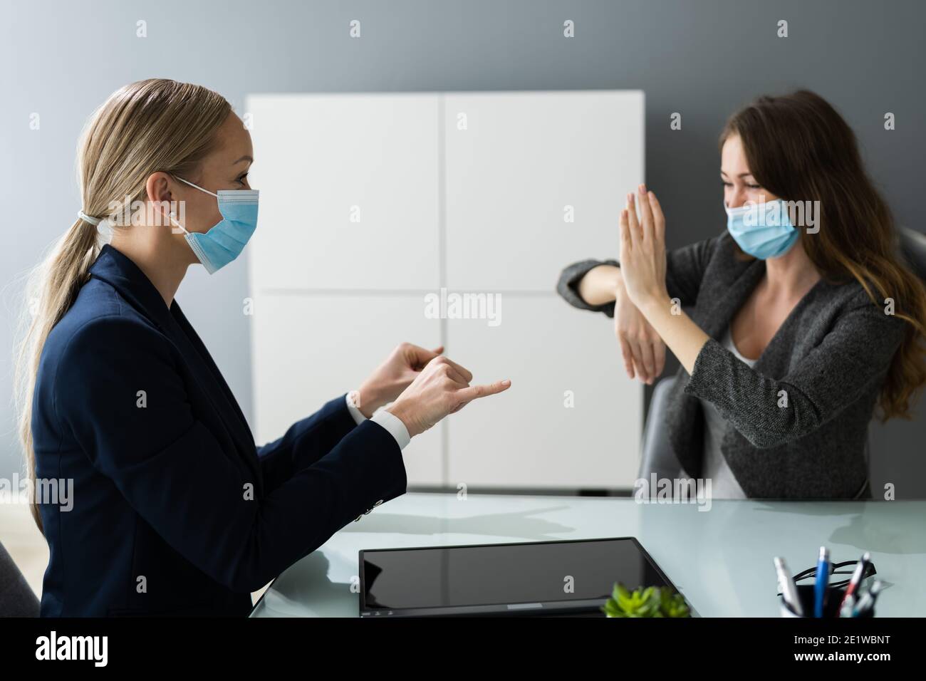 Learning Deaf Sign Language With Face Mask Stock Photo - Alamy