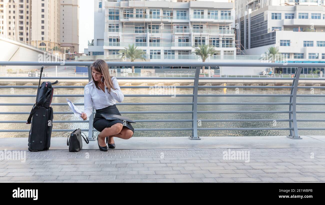 Middle aged Business woman in format outfit going to airport Stock ...