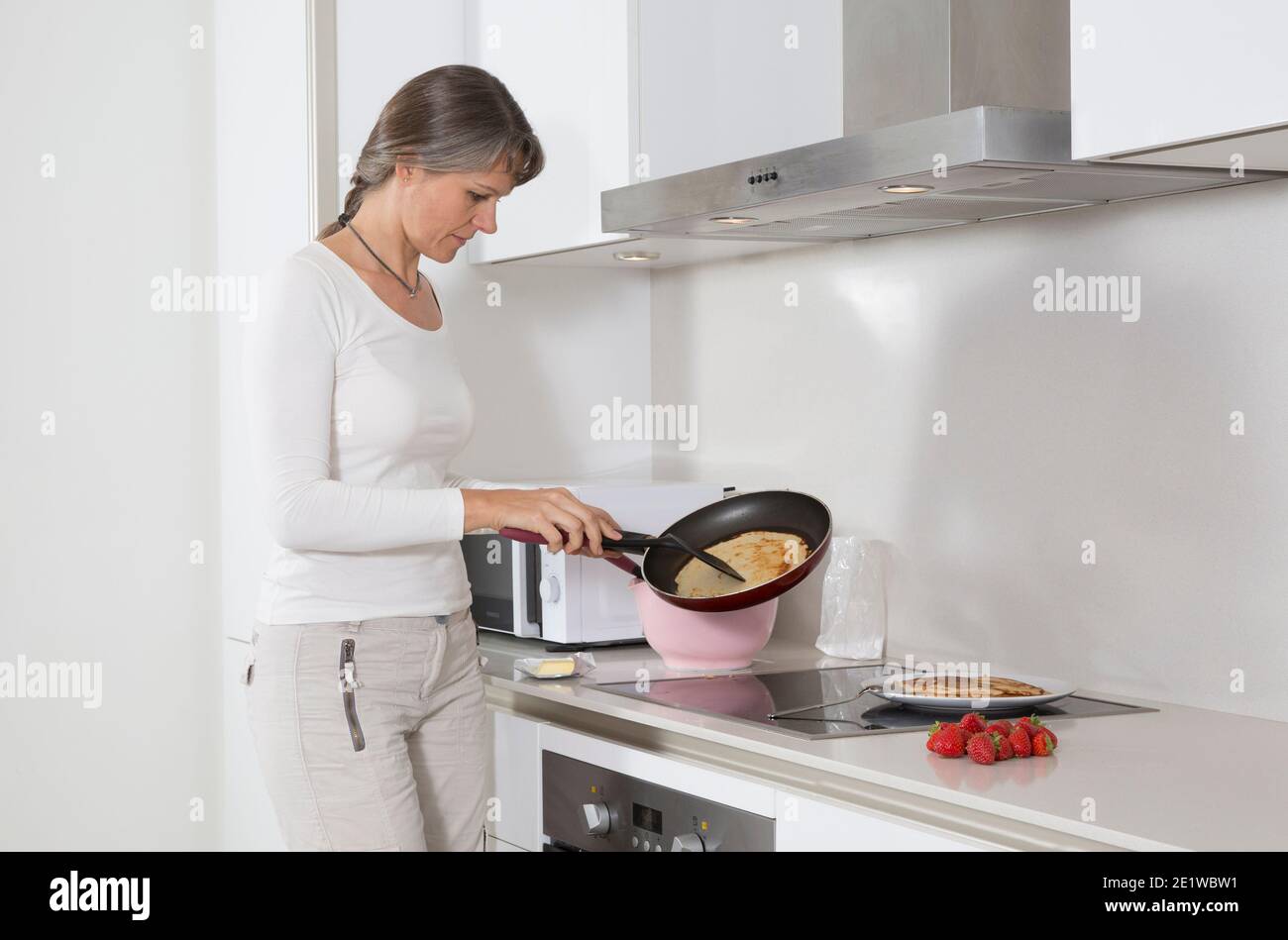 Female middle aged one kitchen hi-res stock photography and images - Alamy