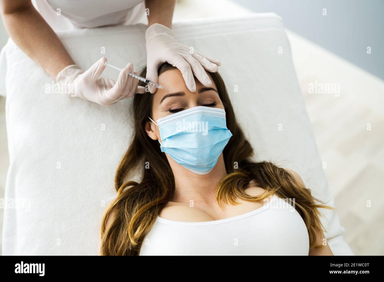 Plastic Surgery Filler Injection In Medical Face Mask Stock Photo - Alamy