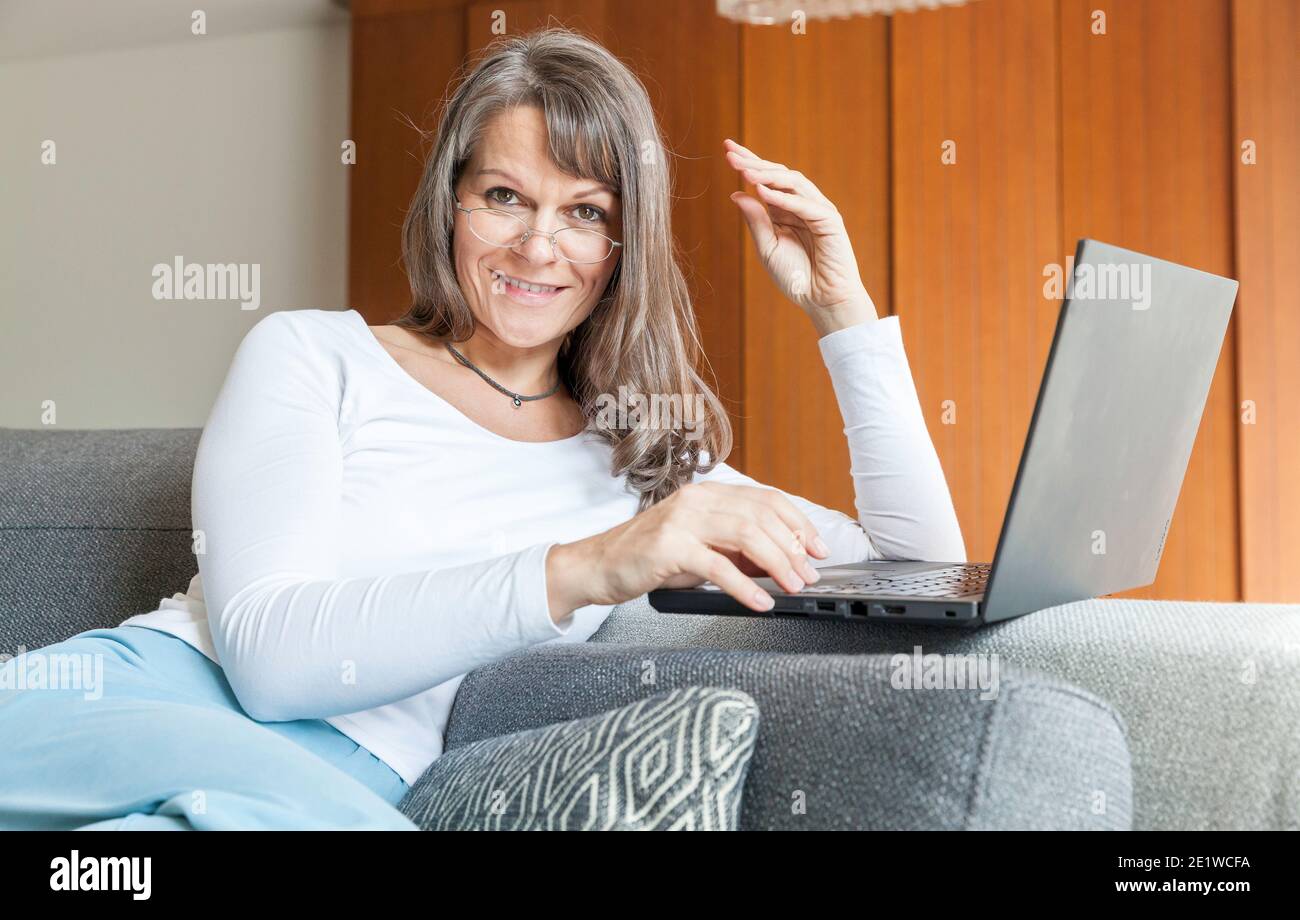 Grandma happy with her new computer as she is using to connect with her ...