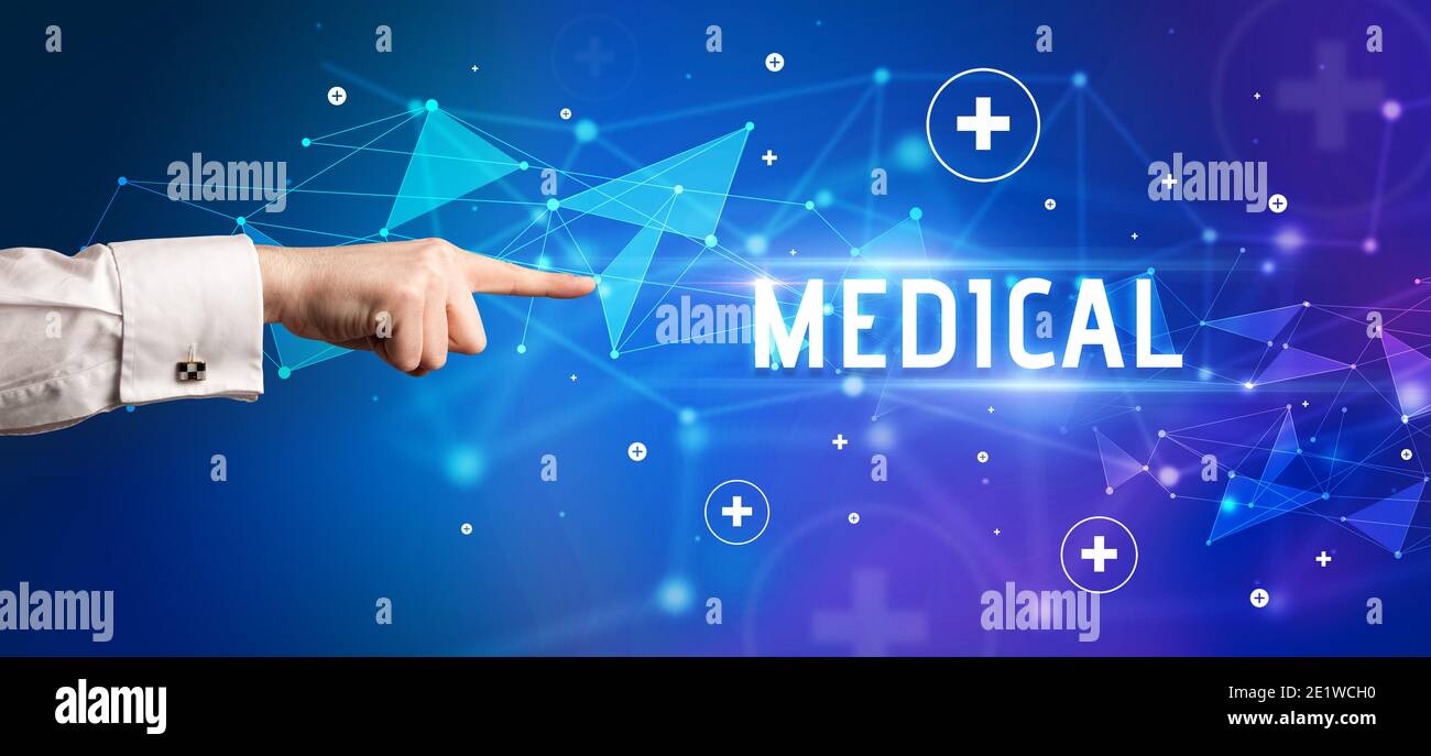 Close-Up of cropped hand pointing at MEDICAL inscription, medical ...