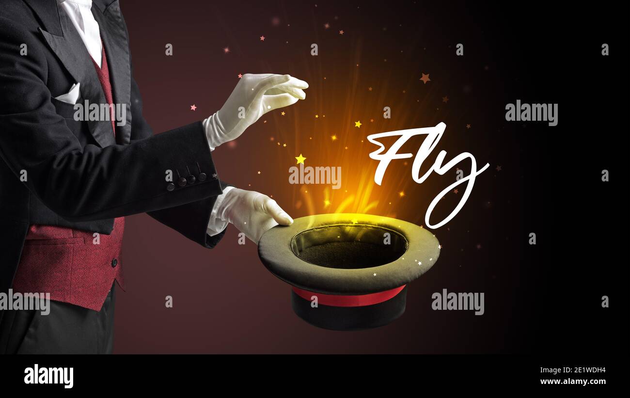 Magician is showing magic trick with Fly inscription, traveling concept ...