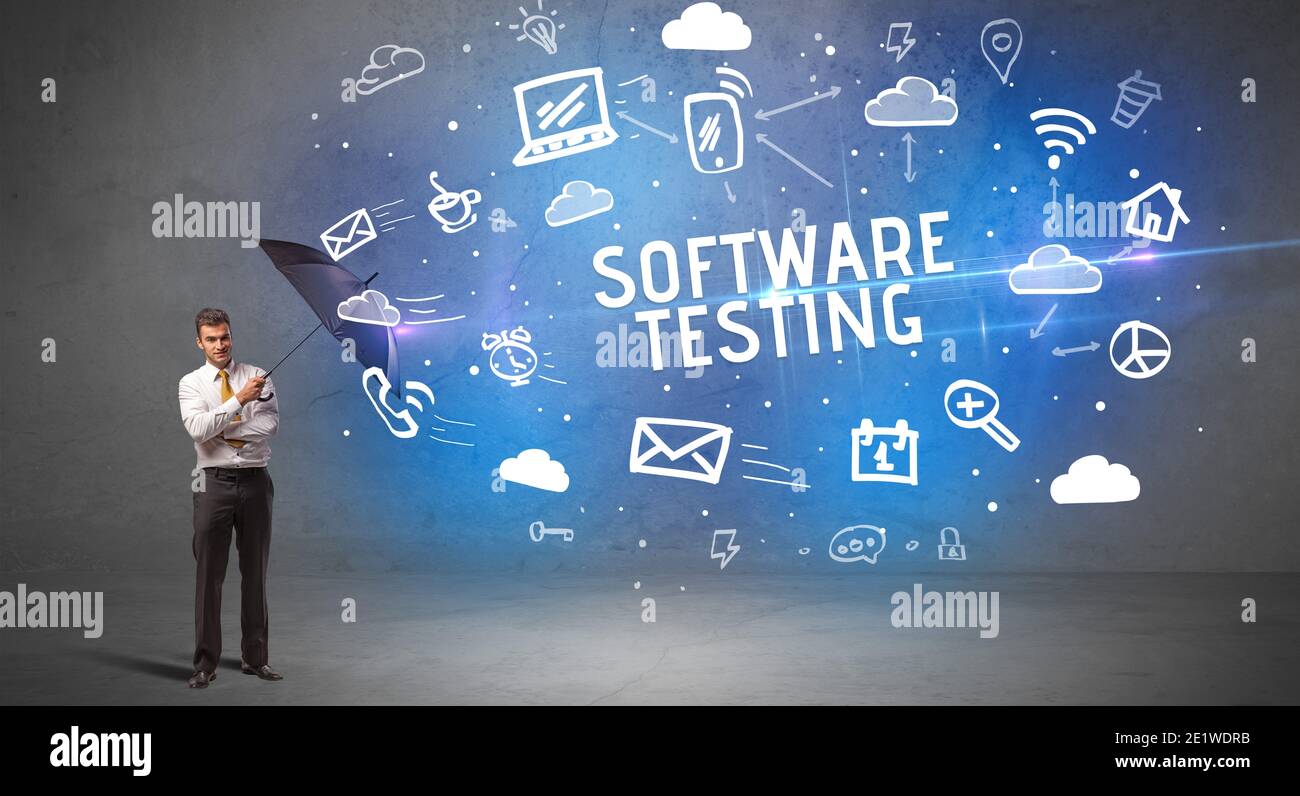 Businessman defending with umbrella from SOFTWARE TESTING inscription ...