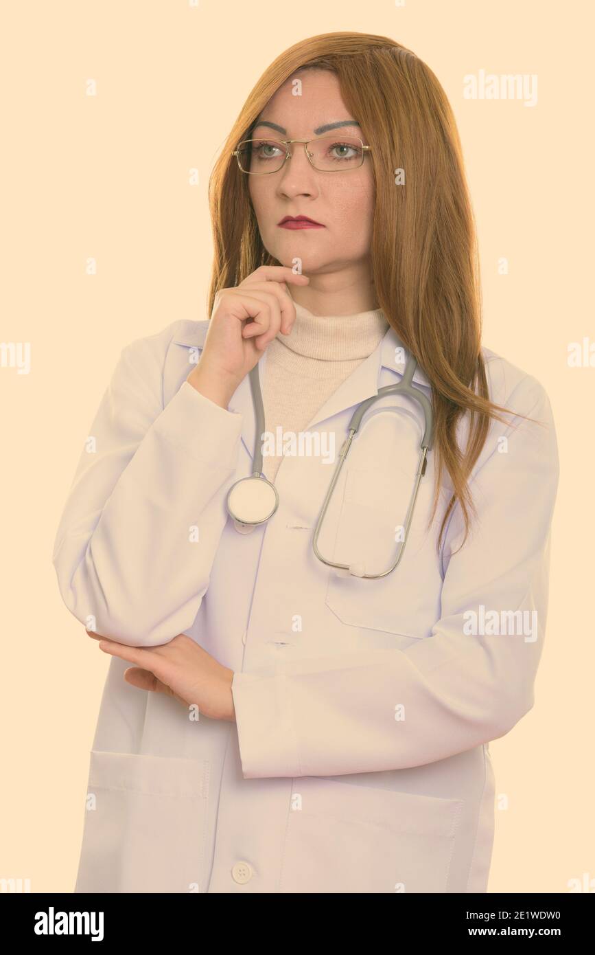 Female doctor thinking hi-res stock photography and images - Alamy