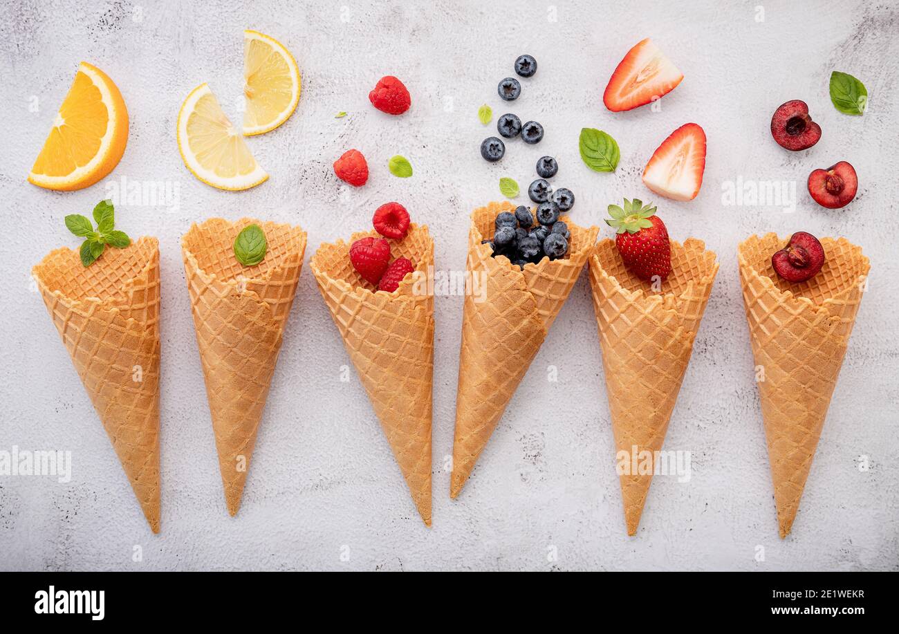 Various of fruits in cones blueberry ,strawberry ,raspberries and ...