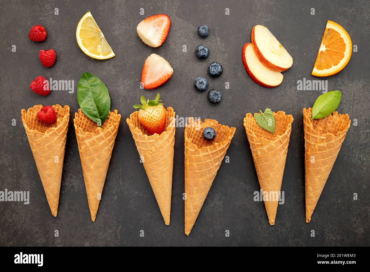 Various of fruits in cones blueberry ,strawberry ,raspberries and ...