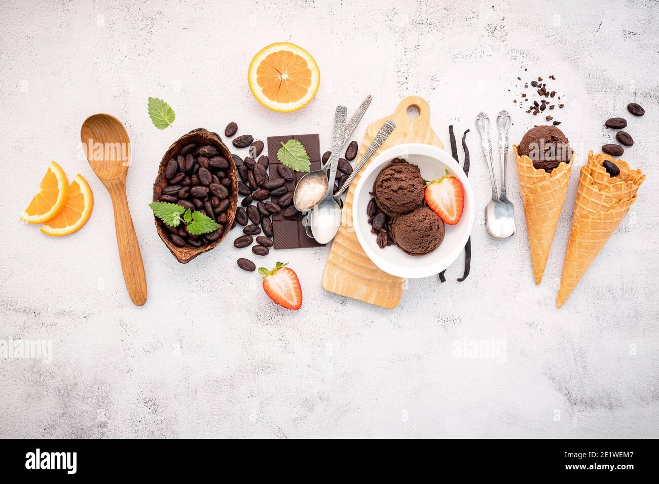 Chocolate ice cream flavours in bowl with dark chocolate and cacao nibs ...