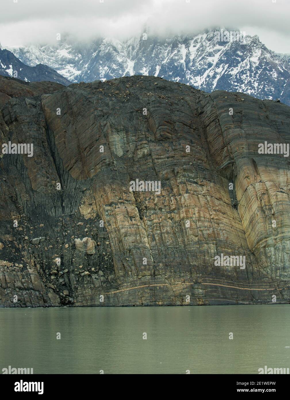 Bare rock scraped by a glacier on the shore of Lago Grey, at Glacier ...