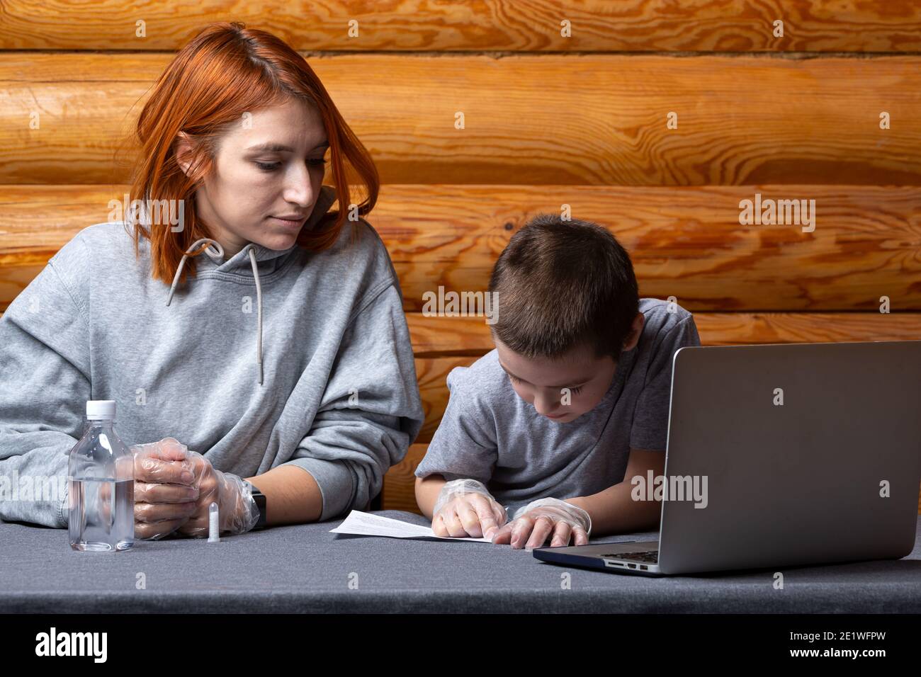 Chemistry education and study concept. Little boy reads instructions ...