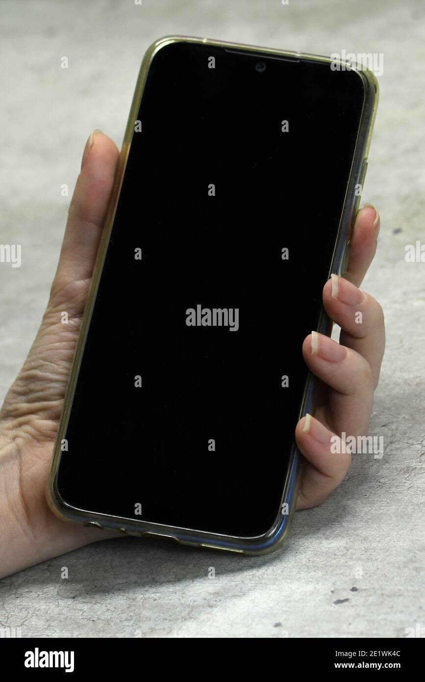 Woman showing off photo on phone hi-res stock photography and images ...