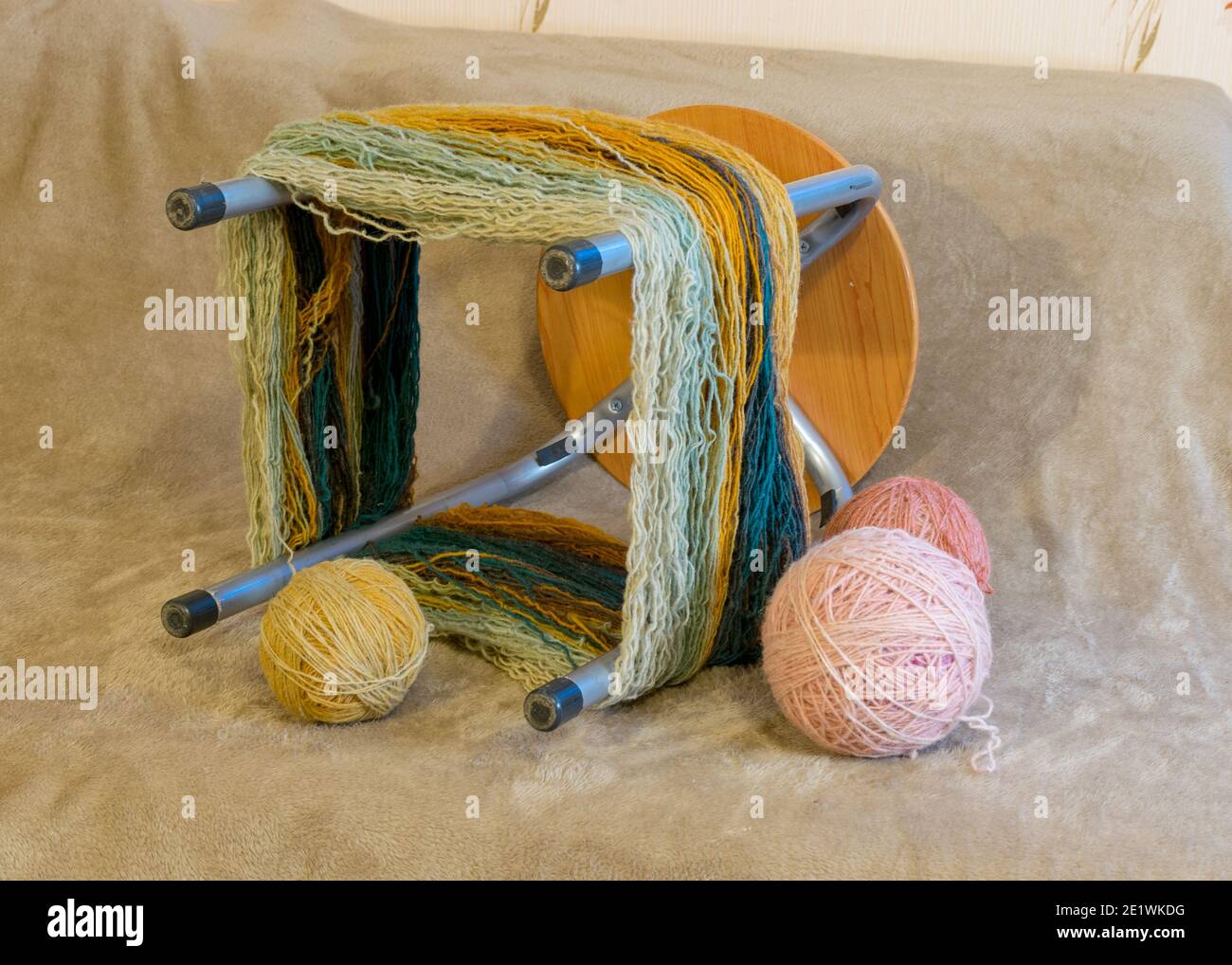 picture with yarn spools and balls of wool thread, skeins prepared for ...