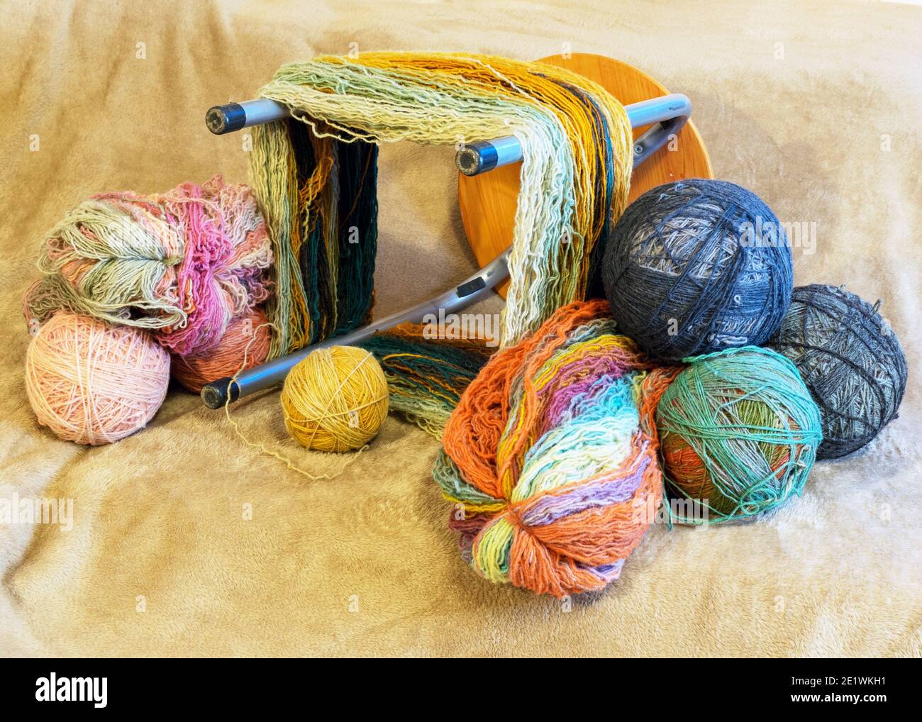 picture with yarn spools and balls of wool thread, skeins prepared for ...