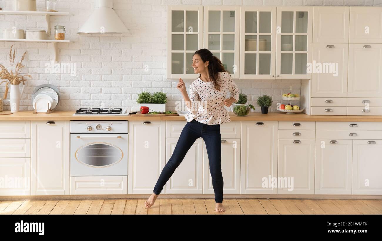 Caucasian girl dancing in kitchen hi-res stock photography and images ...
