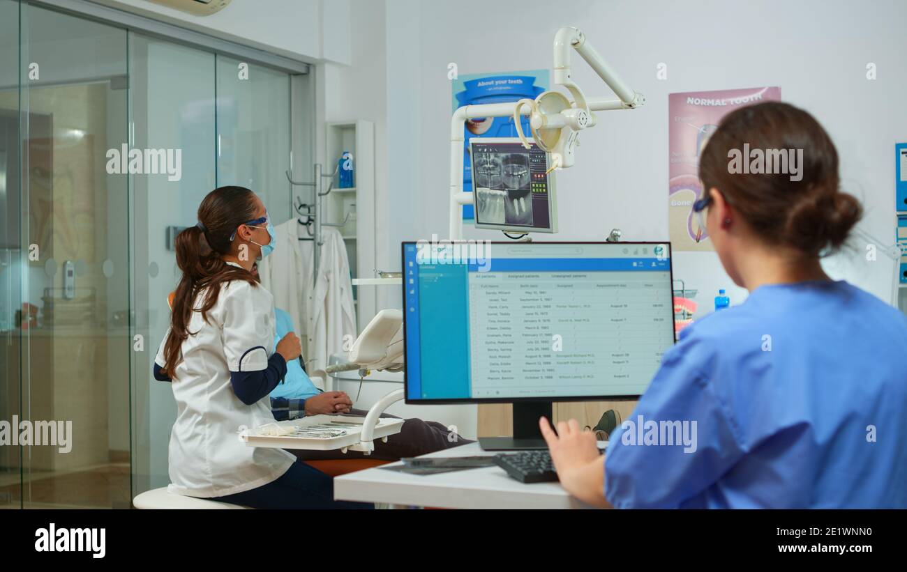 Dentist assistant making appointments hi-res stock photography and ...