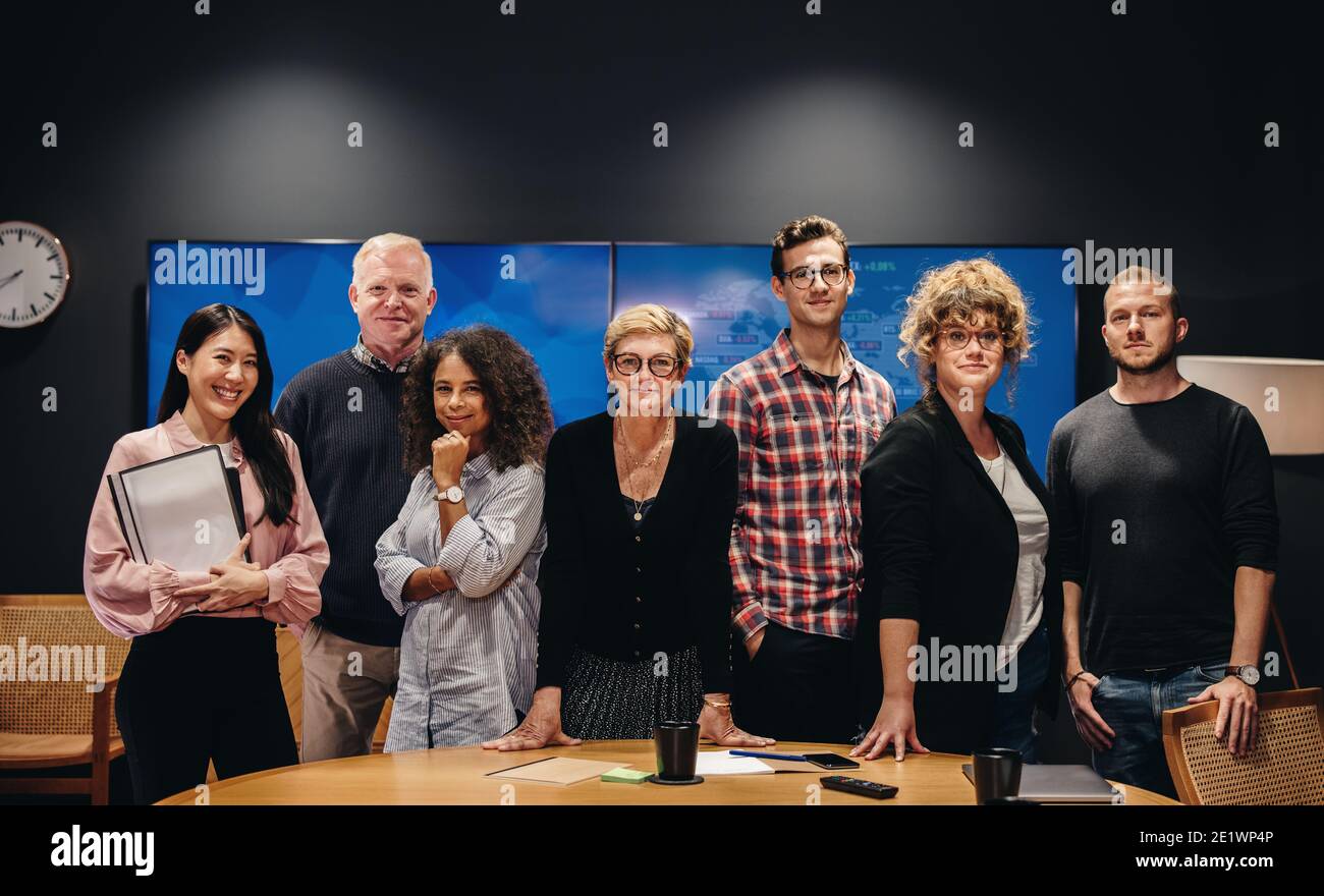 Portrait of successful business people standing together. Team of ...