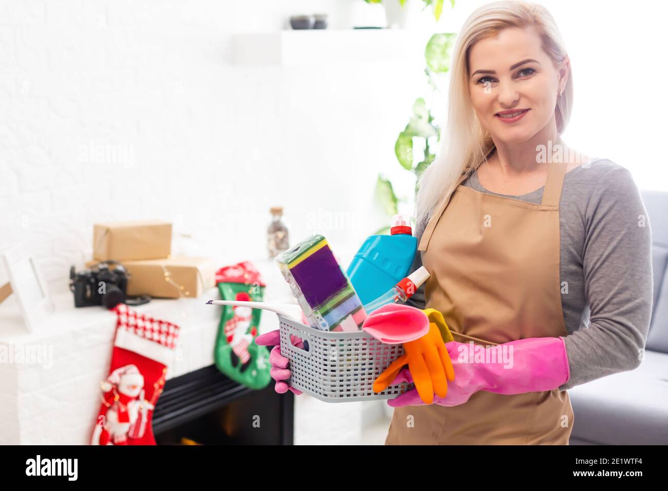 Woman cleaning up party hi-res stock photography and images - Alamy