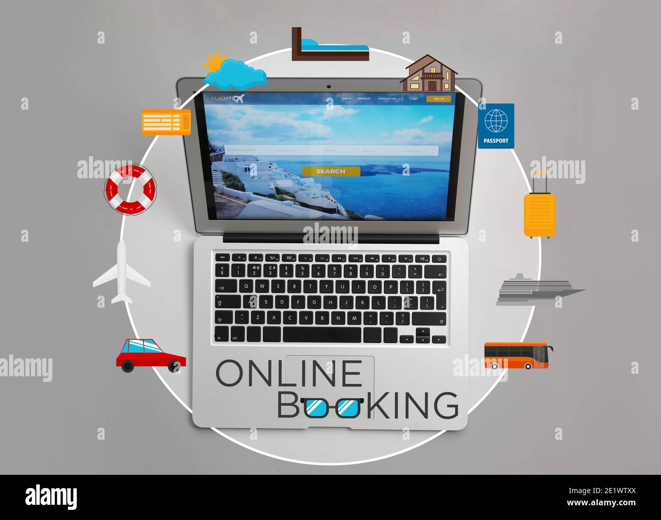 Open page of online booking service on screen of laptop on grey ...