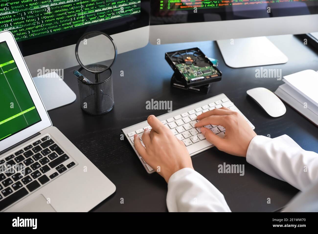 Female programmer working in office Stock Photo - Alamy