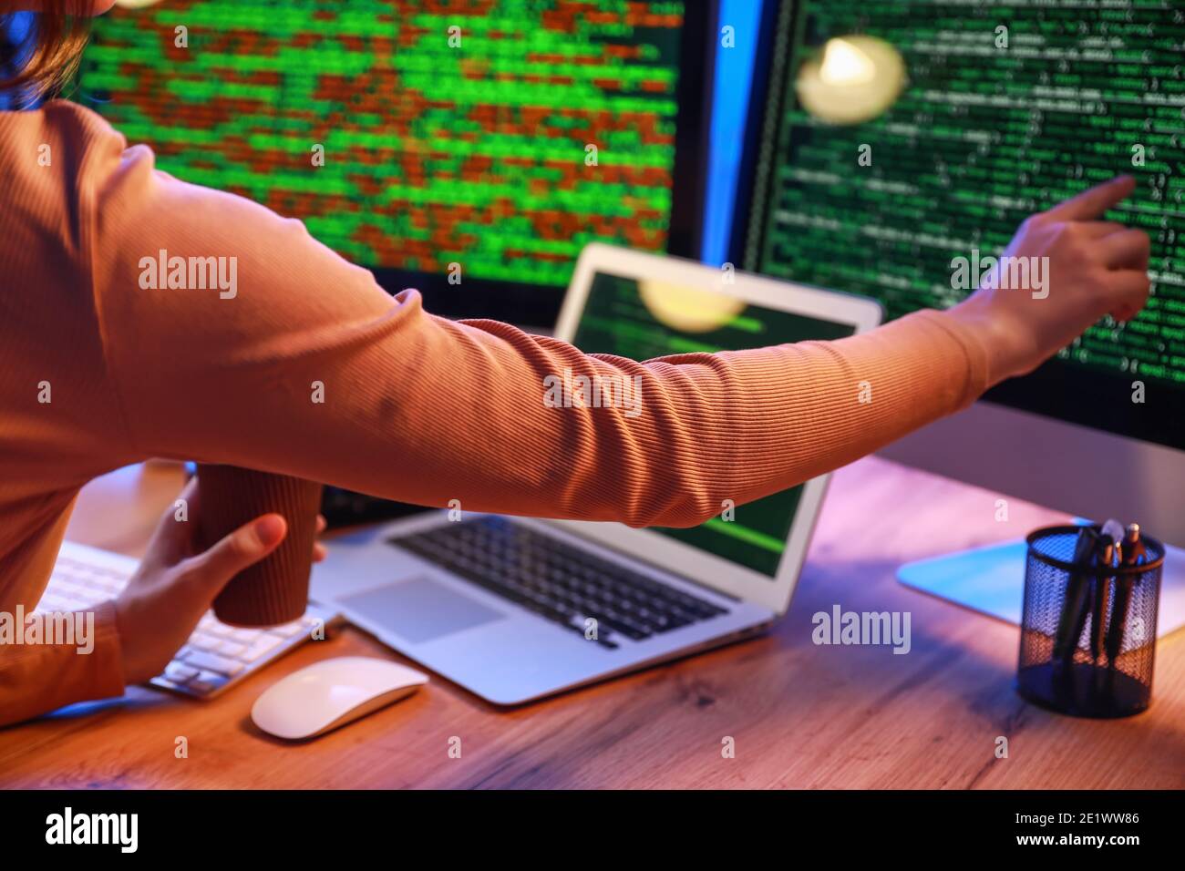 Female programmer working in office Stock Photo - Alamy