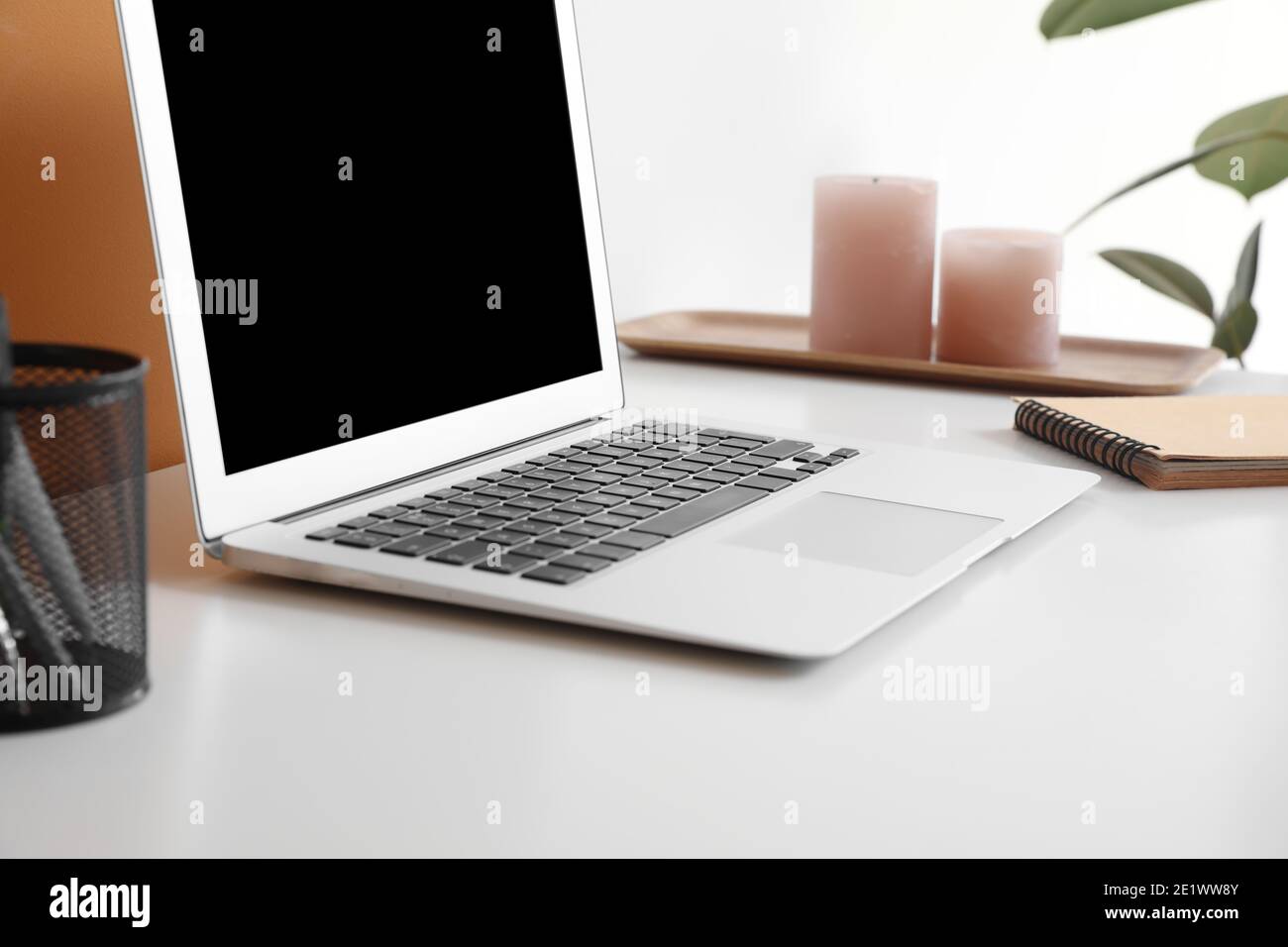 Modern laptop on white table Stock Photo - Alamy