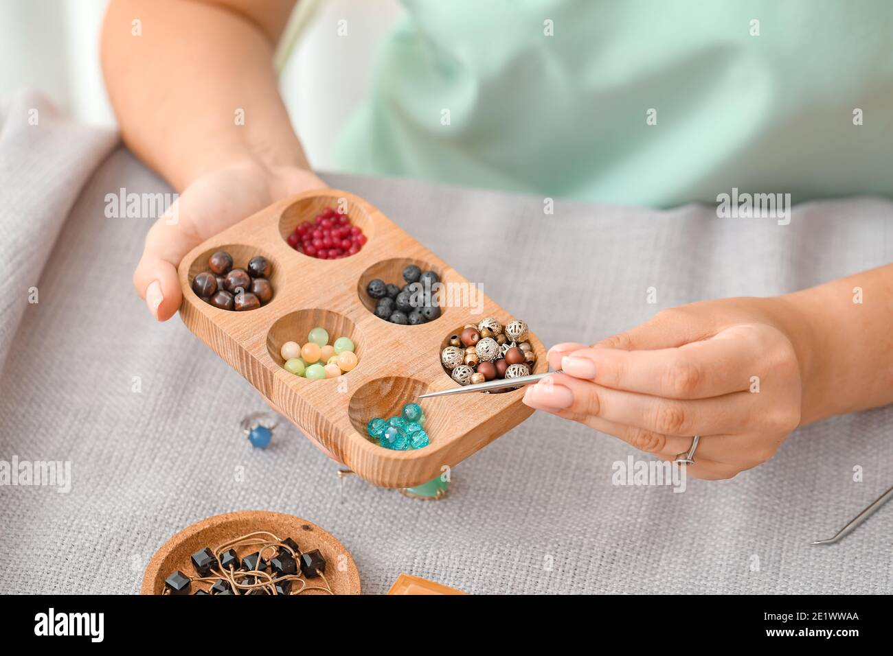 Female designer making jewelry at workplace Stock Photo - Alamy