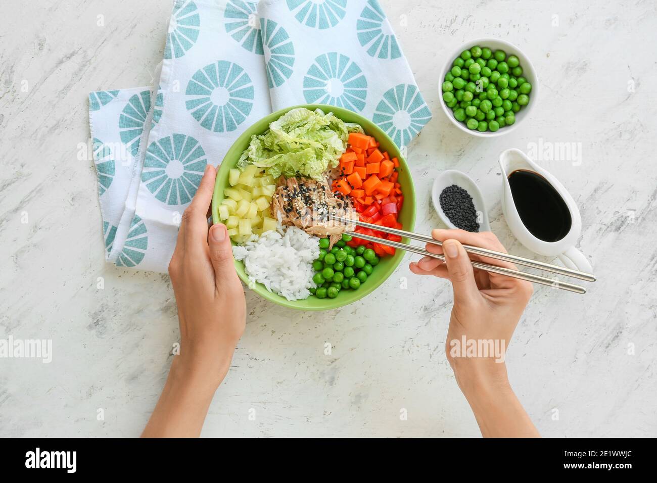 View woman eating poke bowl hi-res stock photography and images - Alamy