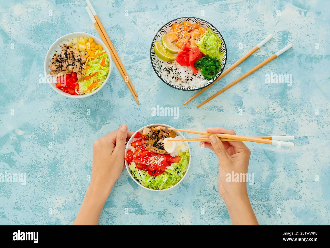 View woman eating poke bowl hi-res stock photography and images - Alamy