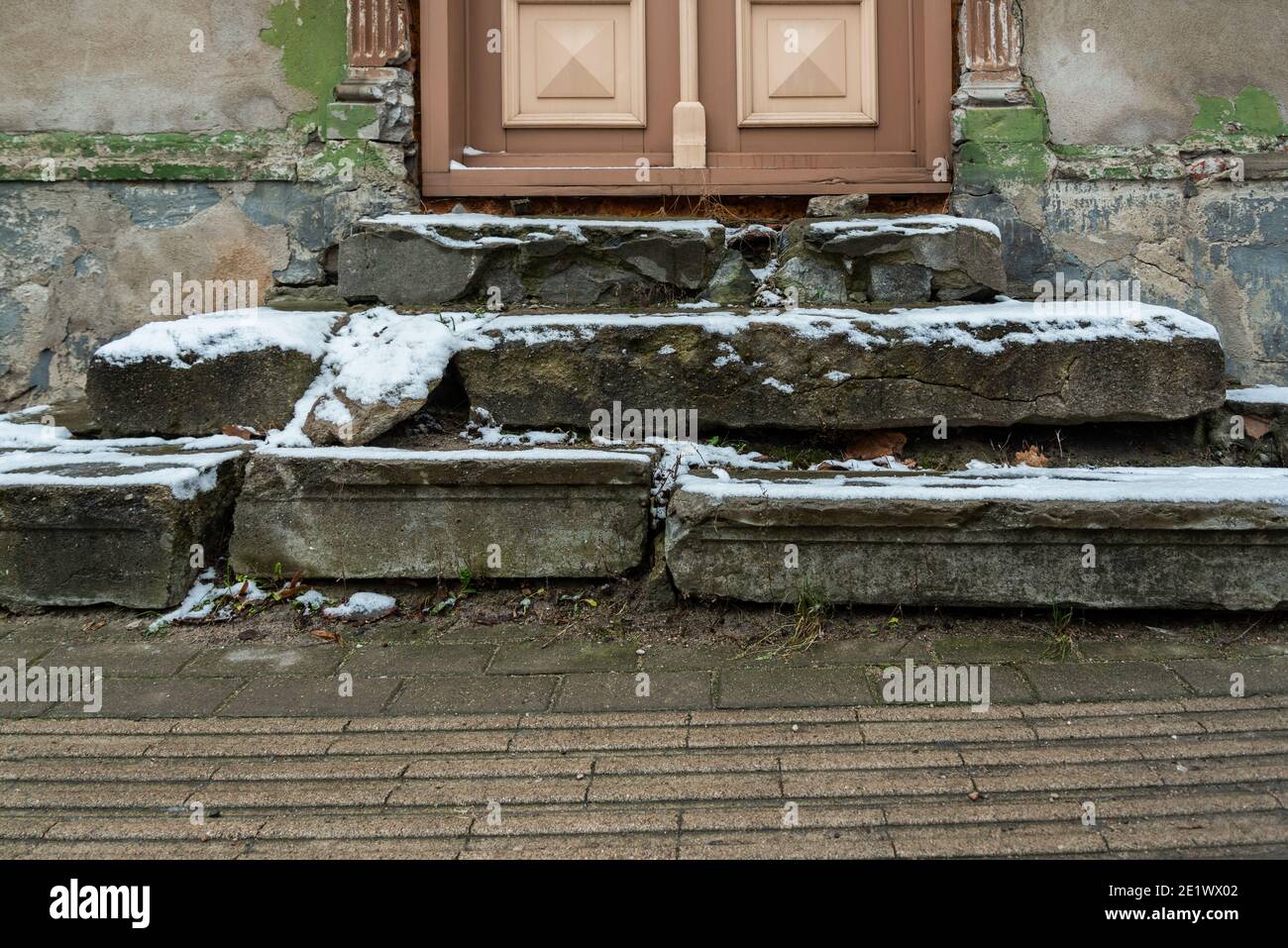Stone threshold covered with snow Stock Photo - Alamy