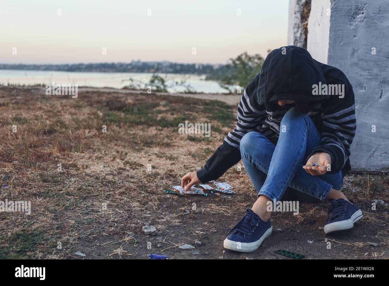 Female junkie taking drugs outdoors Stock Photo - Alamy